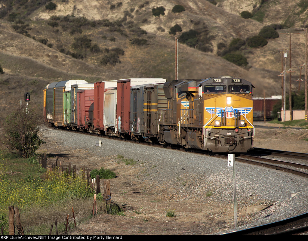 UP 7351 Rolls Down the Hill With Mixed Freight